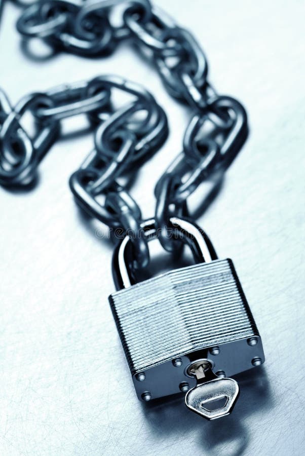 Secure Steel Padlock and Chain with Key on Scratched Steel Surface ...