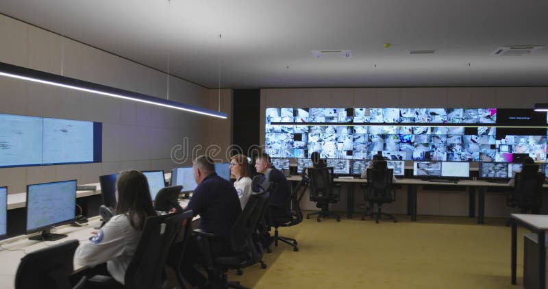Security Guards Monitoring Modern CCTV Cameras in Surveillance Room ...