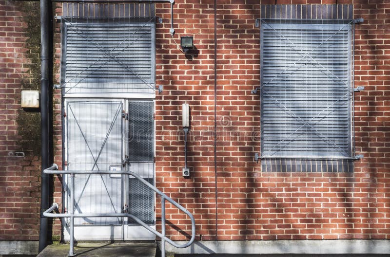 Security: Door and Windows Protected by Galvanised Metal Shutters ...