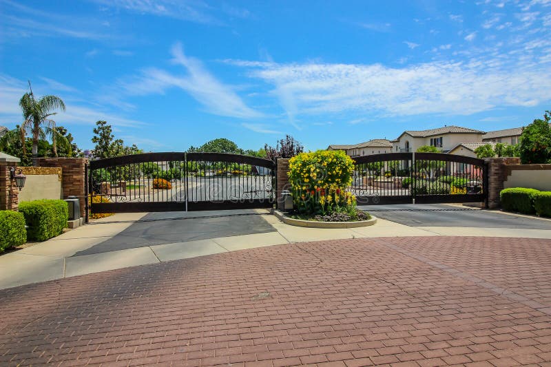 Security Gates at Housing Subdivision Stock Photo - Image of exit, tree ...