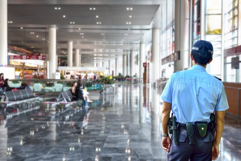 Security guard in airport stock image. Image of person - 67192867