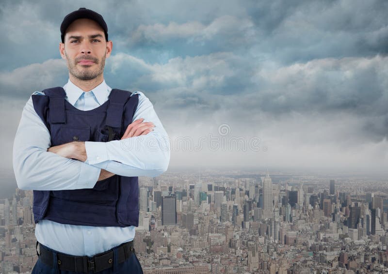 Security Guard with Arms Folded Against Skyline and Clouds Stock Photo ...
