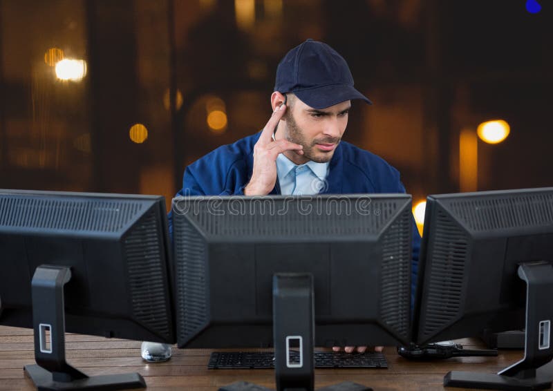 Security Guard Smiling in Front of the Computers with Tablet Stock ...