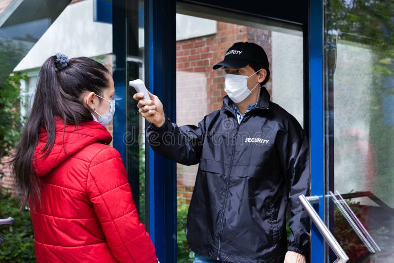 Security Guard Checking Temperature Stock Photo - Image of medical ...