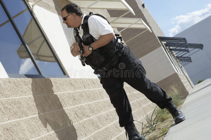 Security Guard in Bulletproof Vest Holding Gun Stock Image - Image of ...