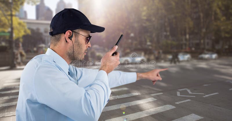 Security Guard Holding Walkie Talkie while Pointing on Road Stock Photo ...