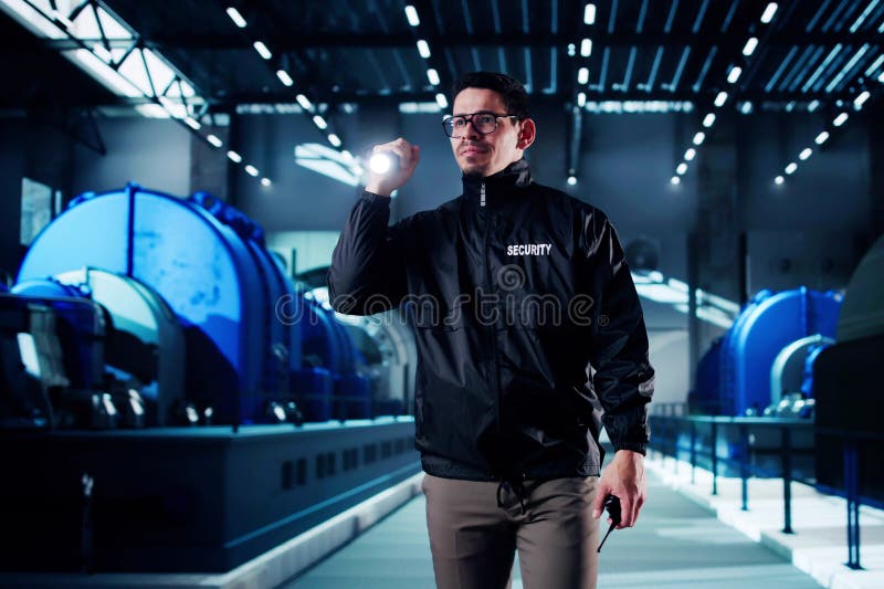 Security Guard Man with Flashlight at Power Plant Stock Image - Image ...