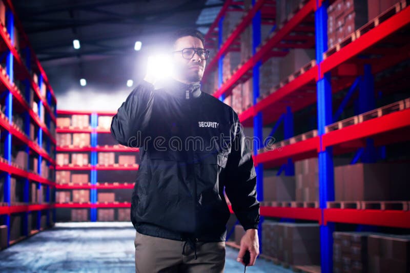Security Guard Man with Flashlight at Warehouse Stock Photo - Image of ...