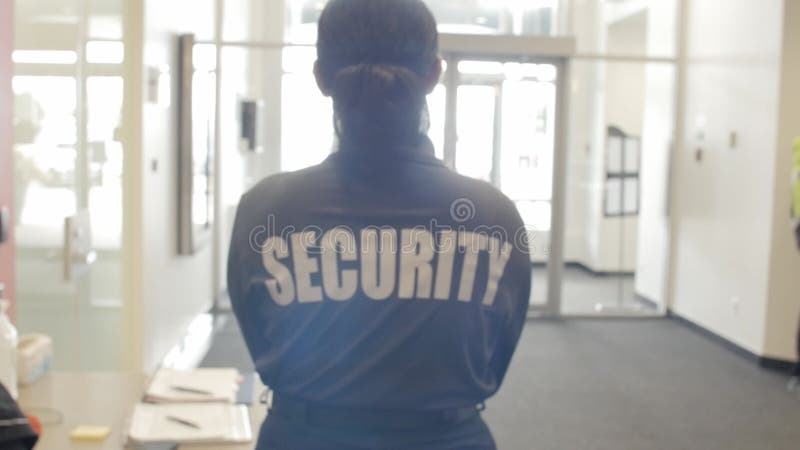 Security Guard Patrolling Office Space Stock Video - Video of ...