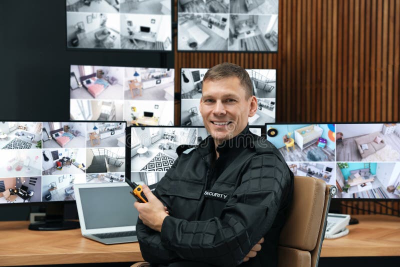 Security Guard with Portable Transmitter at Workplace Stock Photo ...