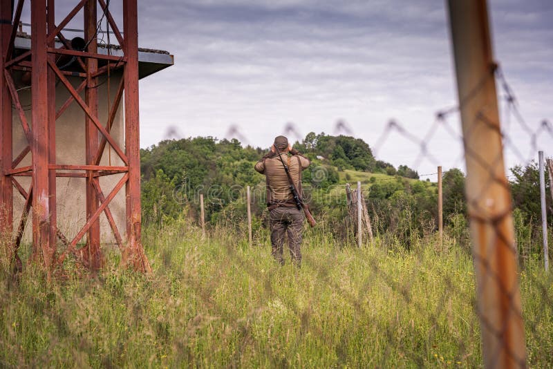 Security Guard in Post Apocalyptic Environment Using Binoculars Stock ...