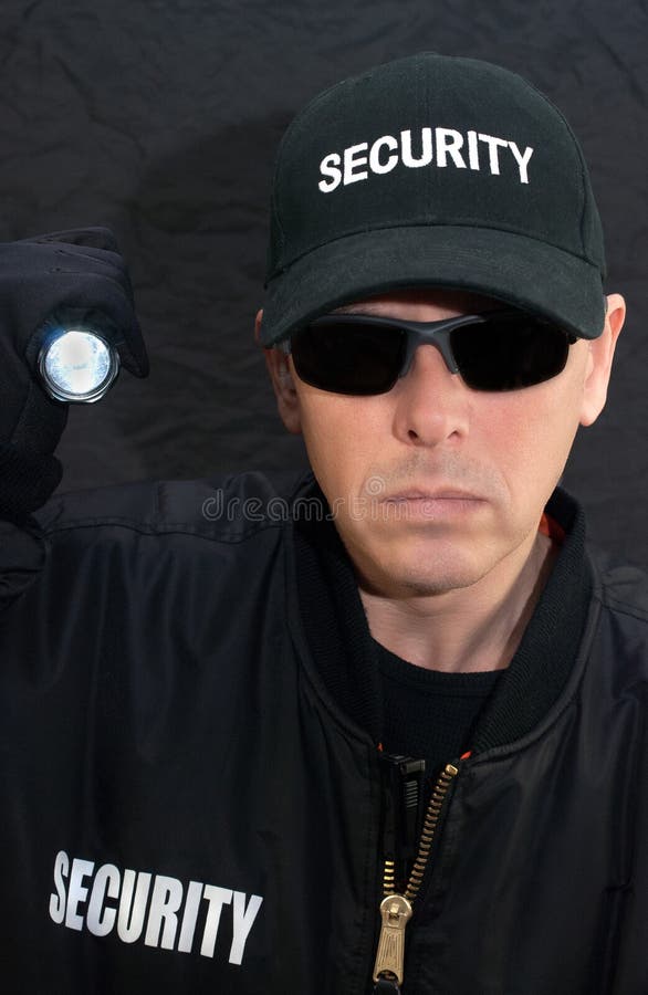 Security Guard Shines Flashlight at the Camera Stock Image - Image of ...
