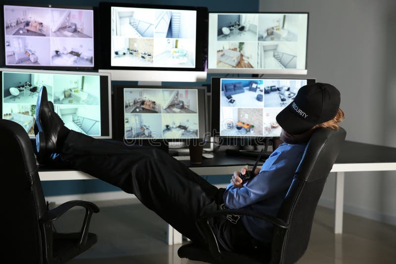 Security Guard Monitoring Modern CCTV Cameras in Surveillance Room ...