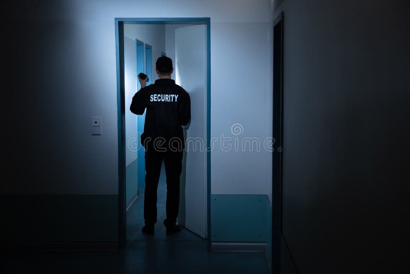 Security Guard Standing in Corridor of Building Stock Image - Image of ...