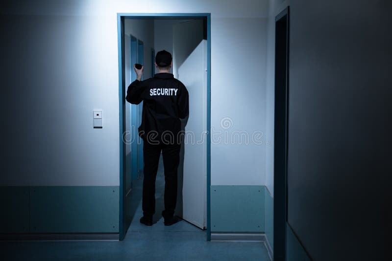 Security Guard Standing in Corridor of Building Stock Photo - Image of ...