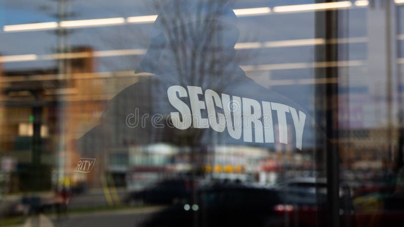 Security Guard Standing Inside Commercial Building Nearby the Window ...