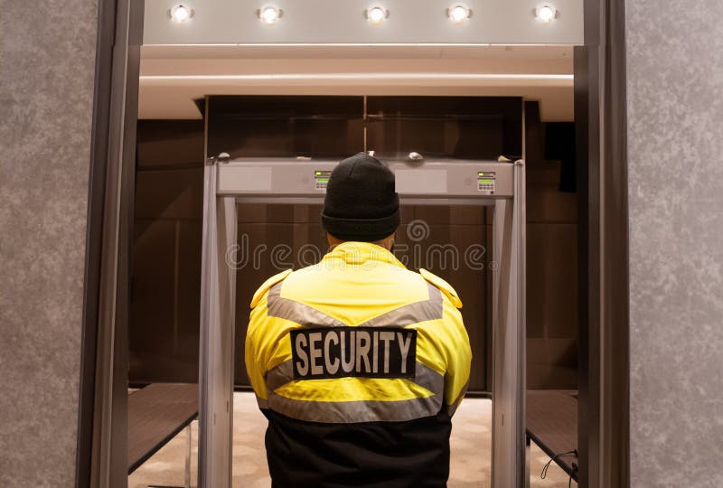 Security Guard Stationed with a Metal Detector Stock Image - Image of ...