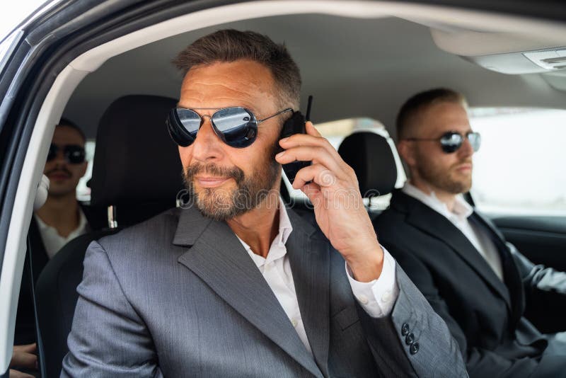 Security Guard in Sunglasses Inside Car Talking Stock Photo - Image of ...