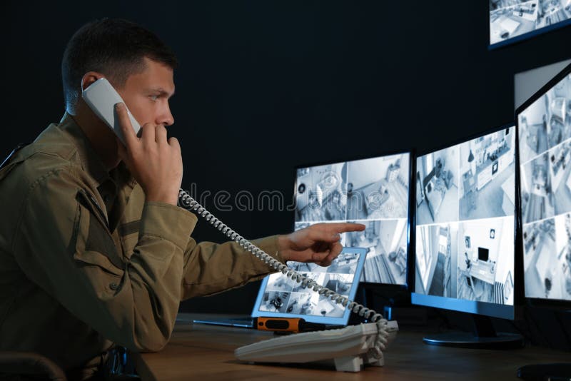 Security Guard Talking on Telephone Stock Image - Image of laptop ...