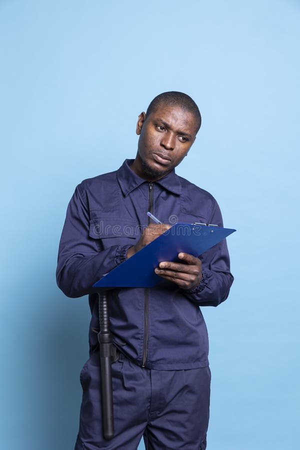 Security Guard Thinking of Activities To Write As His Responsibility ...