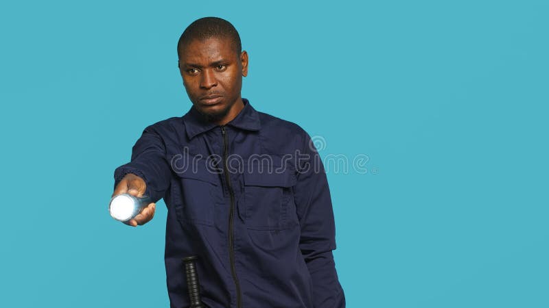 Security Guard Turning on Flashlight To Prevent Criminal Activity Stock ...