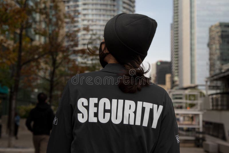 Security Guard in Uniform Patrolling Residential Area Stock Photo ...