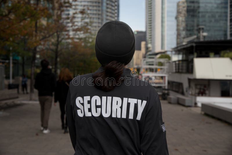 Security Guard in Uniform Patrolling Residential Area Stock Photo ...