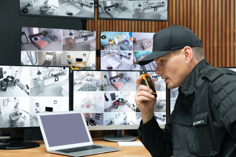 Security Guard Using Portable Transmitter at Workplace Stock Image ...