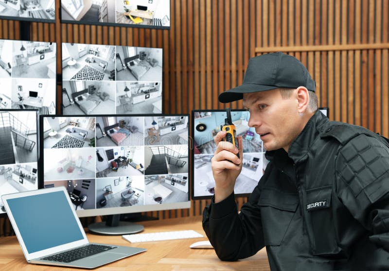 Security Guard Using Portable Transmitter at Workplace Stock Photo ...