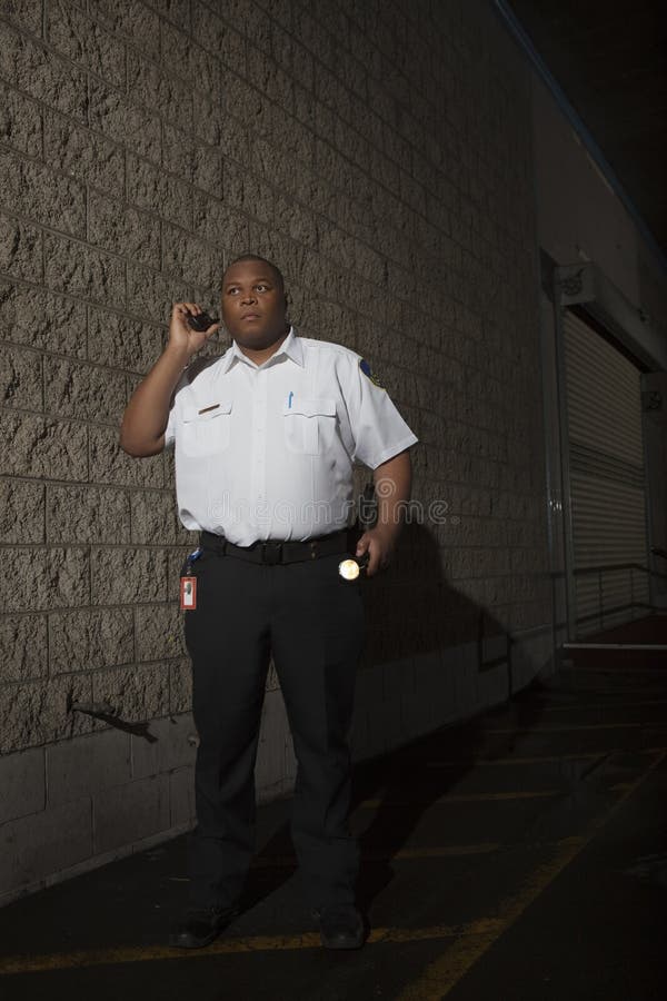 Security Guard Patrols at Night with Torch Stock Photo - Image of ...