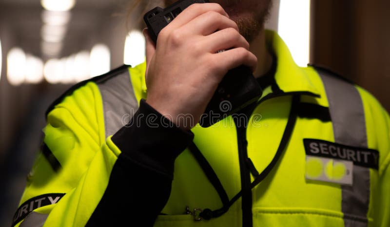 Security Guard Using a Walkie-talkie Radio Stock Image - Image of male ...