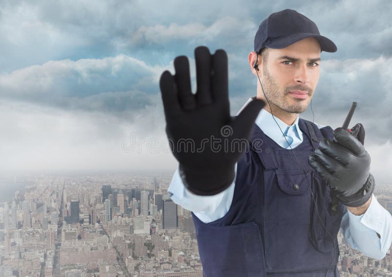 Security Guard with Walkie Talkie and Hand Up Against Skyline and ...