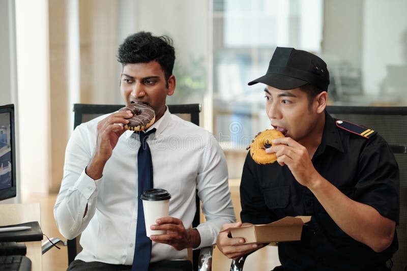 Security Guards Eating Donuts Stock Image - Image of male, occupation ...