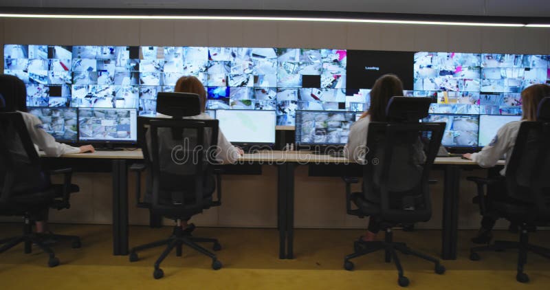 Security Guards Monitoring Modern CCTV Cameras in Surveillance Room ...