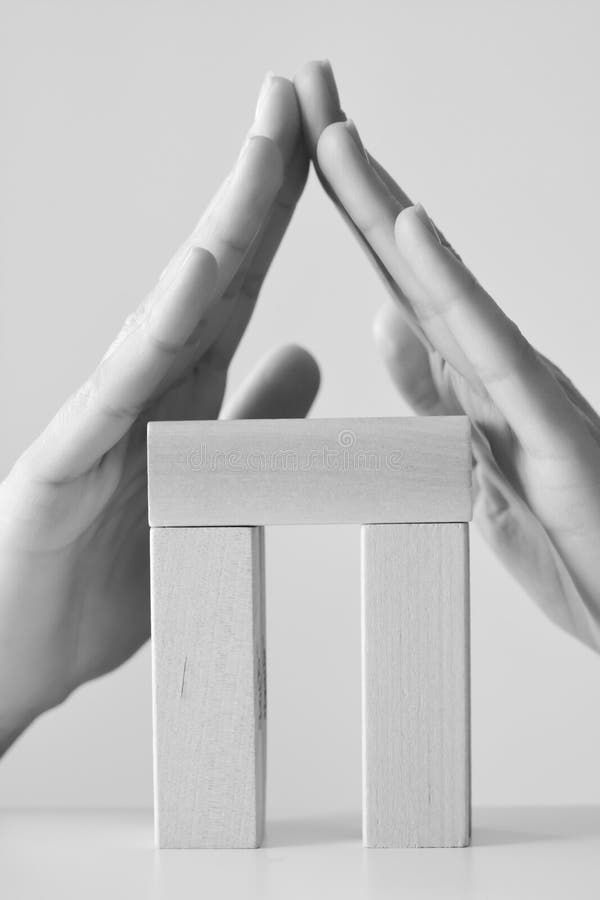 Security or Insurance Concept with Hands Protecting Construction Made ...