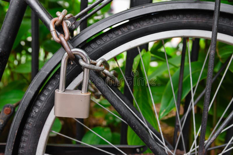 Security Lock and Chain Blocking the Bicycle Wheel Stock Photo - Image ...