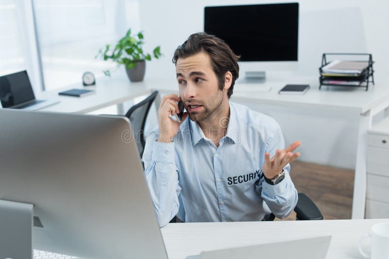 Security Man Gesturing while Talking on Stock Image - Image of call ...