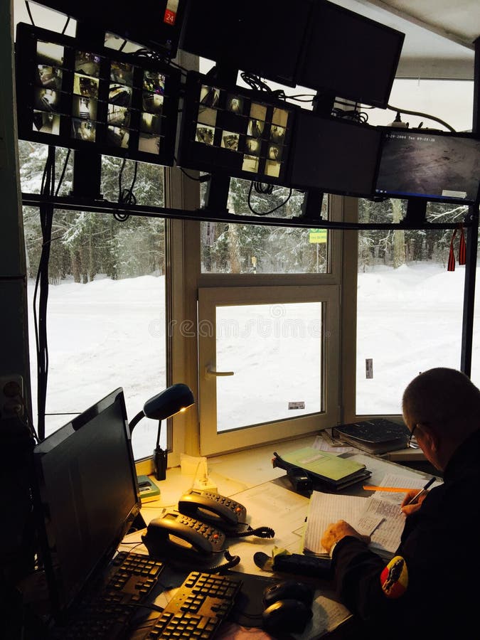 A Security Man Writing Personal Data at a Checkpoint Editorial Stock ...