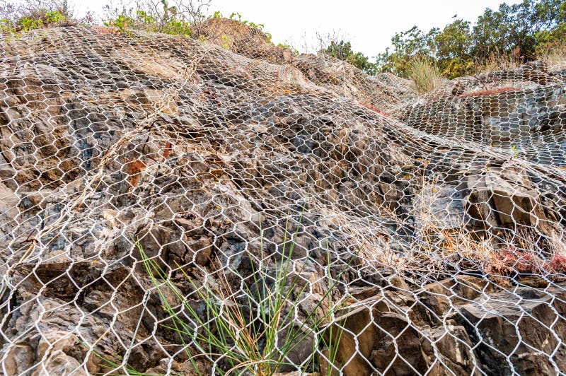 Security Metal Net Covers the Rocky Cliff from Falling Rocks Stock ...