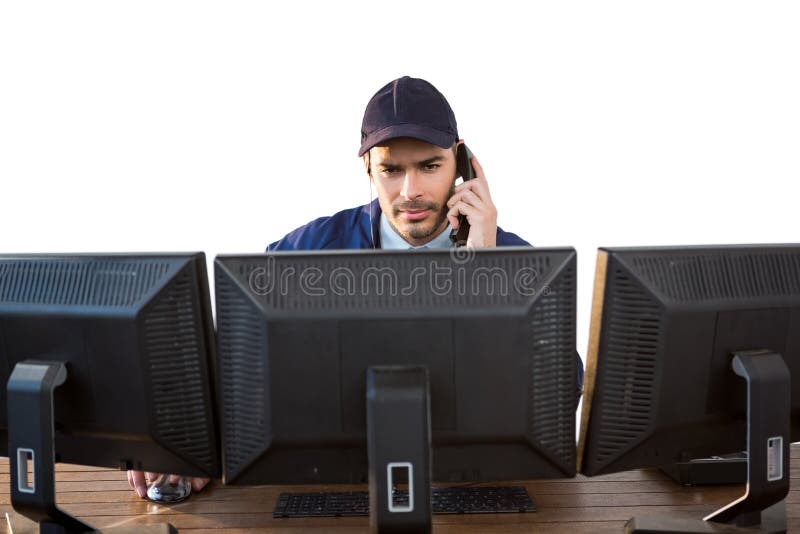 Security Officer Talking on Phone while Using Computer Stock Image ...