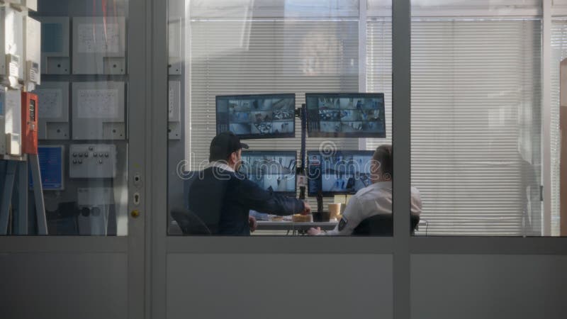 Security Officers Control CCTV Cameras on Computers during Lunch Break ...