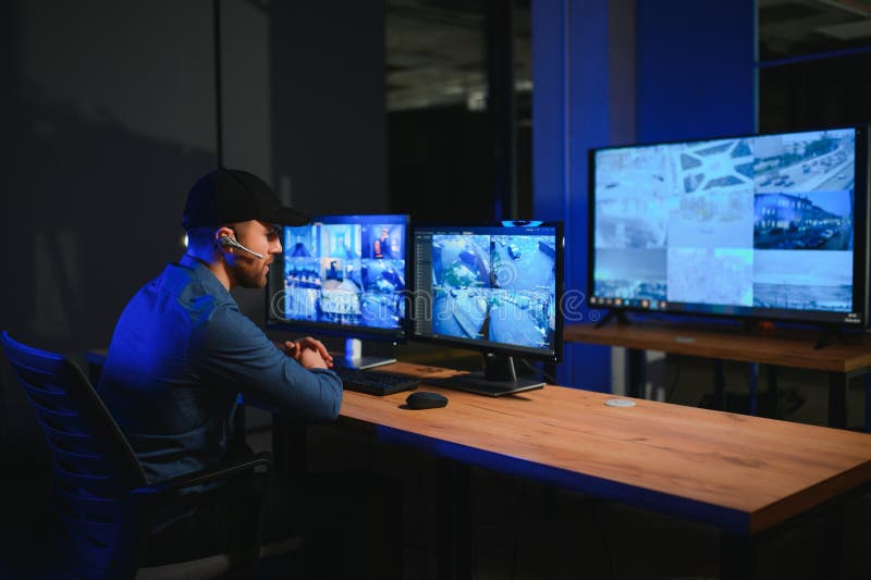 Security Operator Controls CCTV Cameras in Office at Night. Modern ...