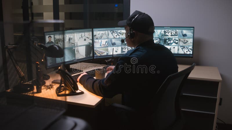 Security Operator in Headset Controls CCTV Cameras Stock Photo - Image ...