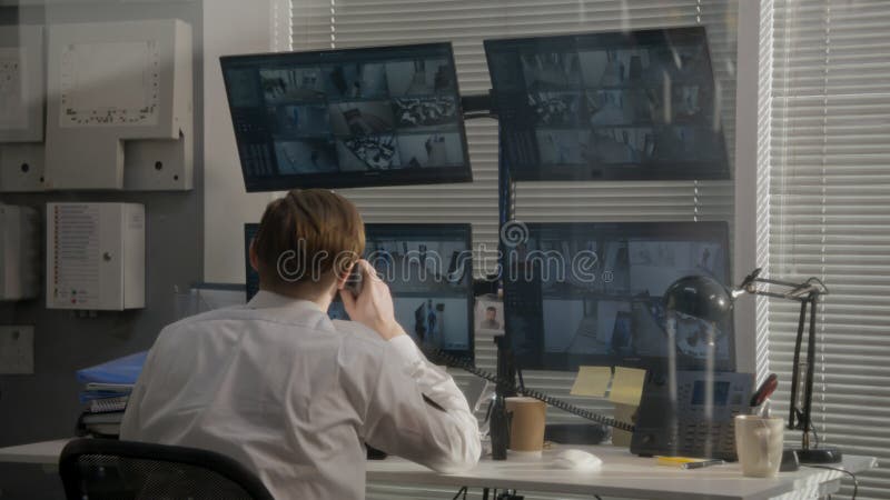 Security Operator Monitors CCTV Cameras on Computers Stock Image ...