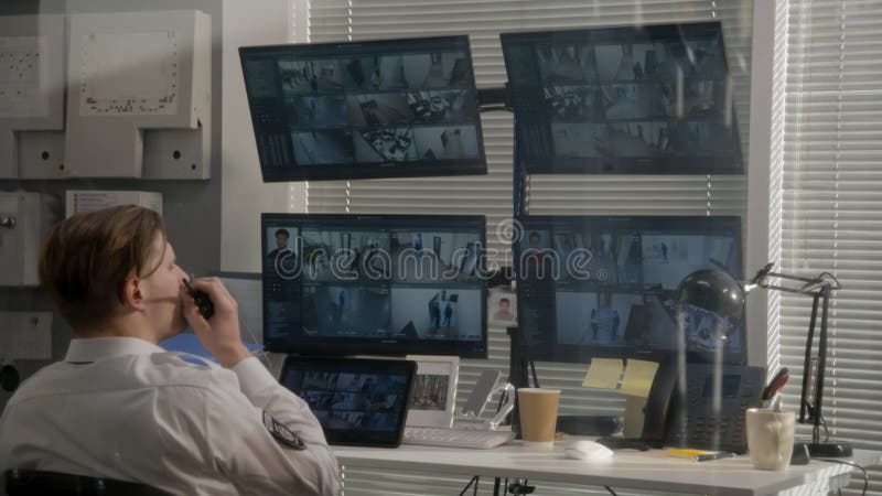 Security Operator Monitors CCTV Cameras on Computers Stock Image ...