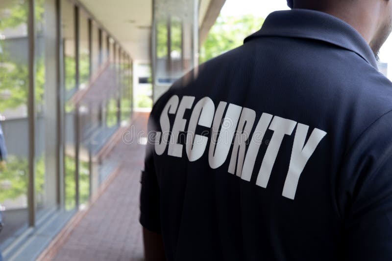 Security Person Standing in the Balcony of a Building Stock Photo ...