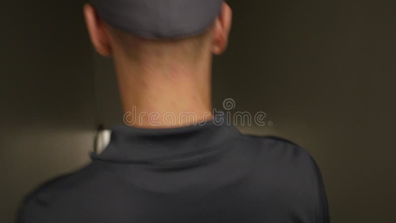 Security Person Walking in the Corridor - Shot from the Back Stock ...