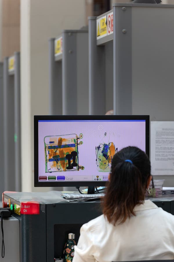 Security Personnel Checking Bags and Backpacks X-rayed at the Access ...