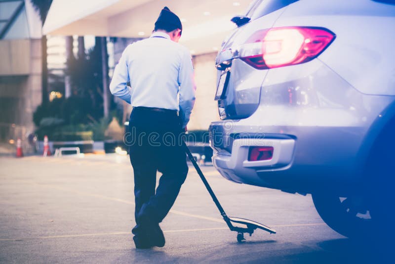 Security Personnel are Checking Safty Under the Car. Befor Entering the ...