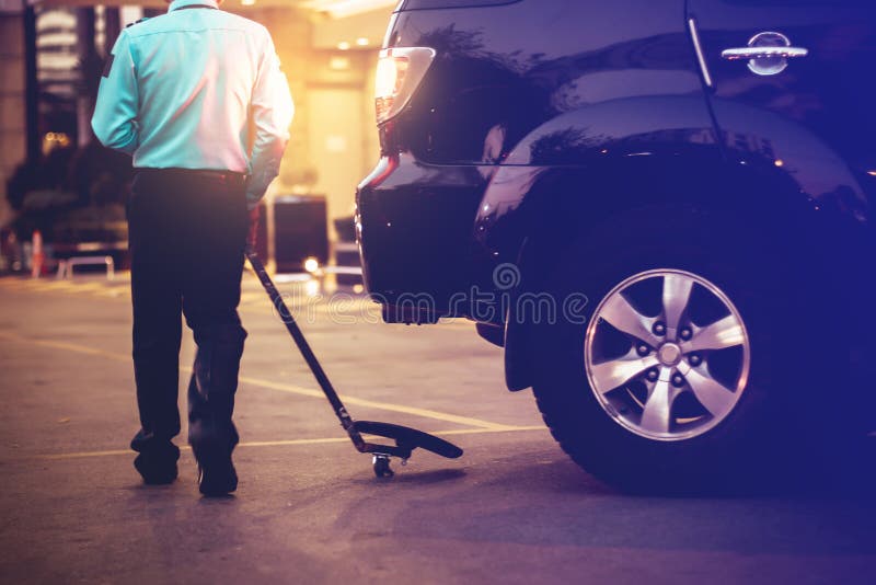 Security Personnel are Checking Safty Under the Car. Befor Entering the ...